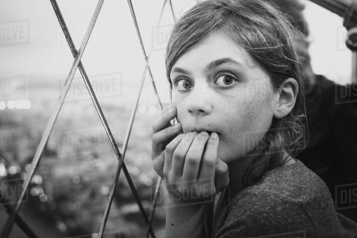 Scared Girl standing on Eiffel Tower, Paris, France - Royalty-free ...