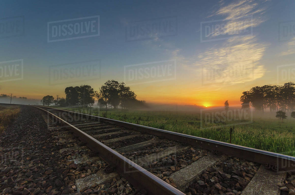 Sunrise over train tracks, New South Wales, Australia - Royalty-free ...