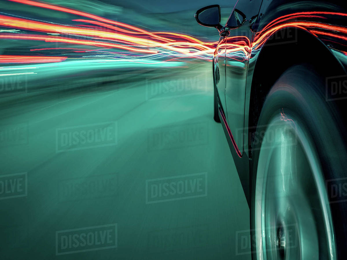 Car driving through traffic - Stock Photo - Dissolve