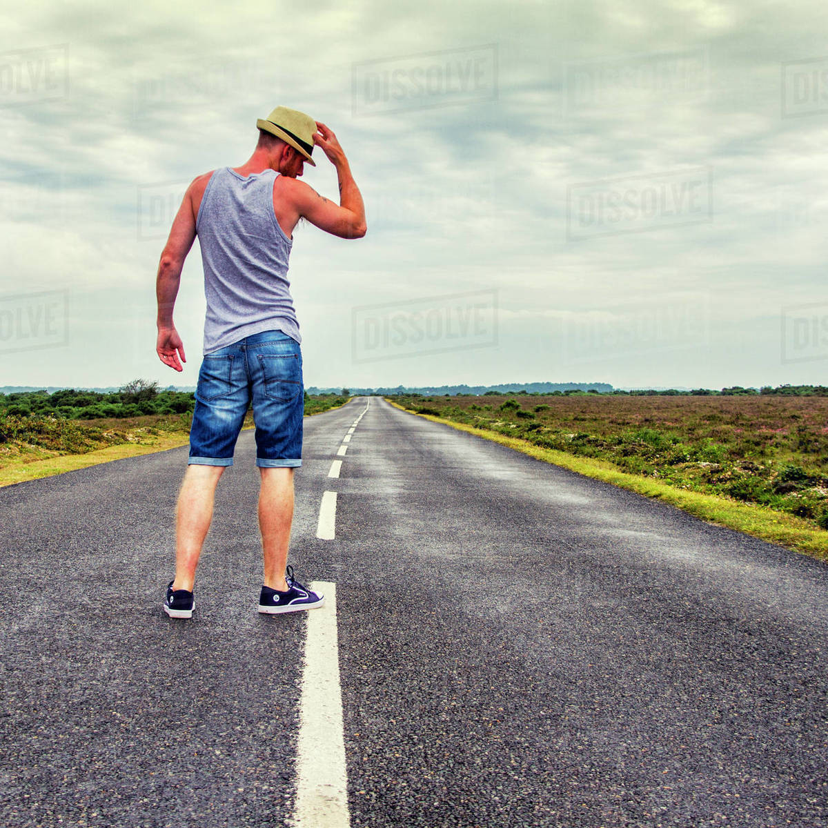 Man standing in the road - Royalty-free Stock Photo | Dissolve