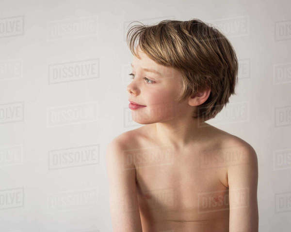 Portrait of a smiling boy looking sideways - Royalty-free Stock Photo ...