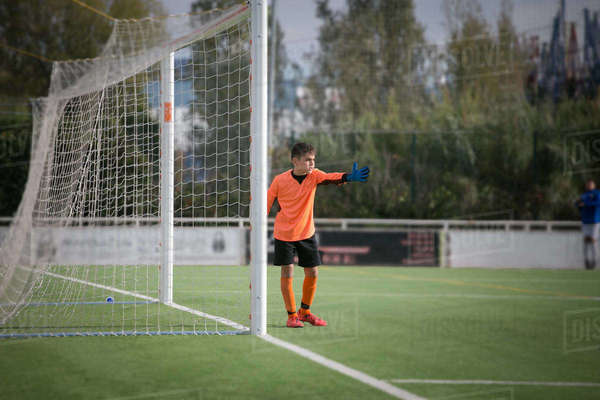Goalkeeper directing his defense, Spain - Stock Photo - Dissolve
