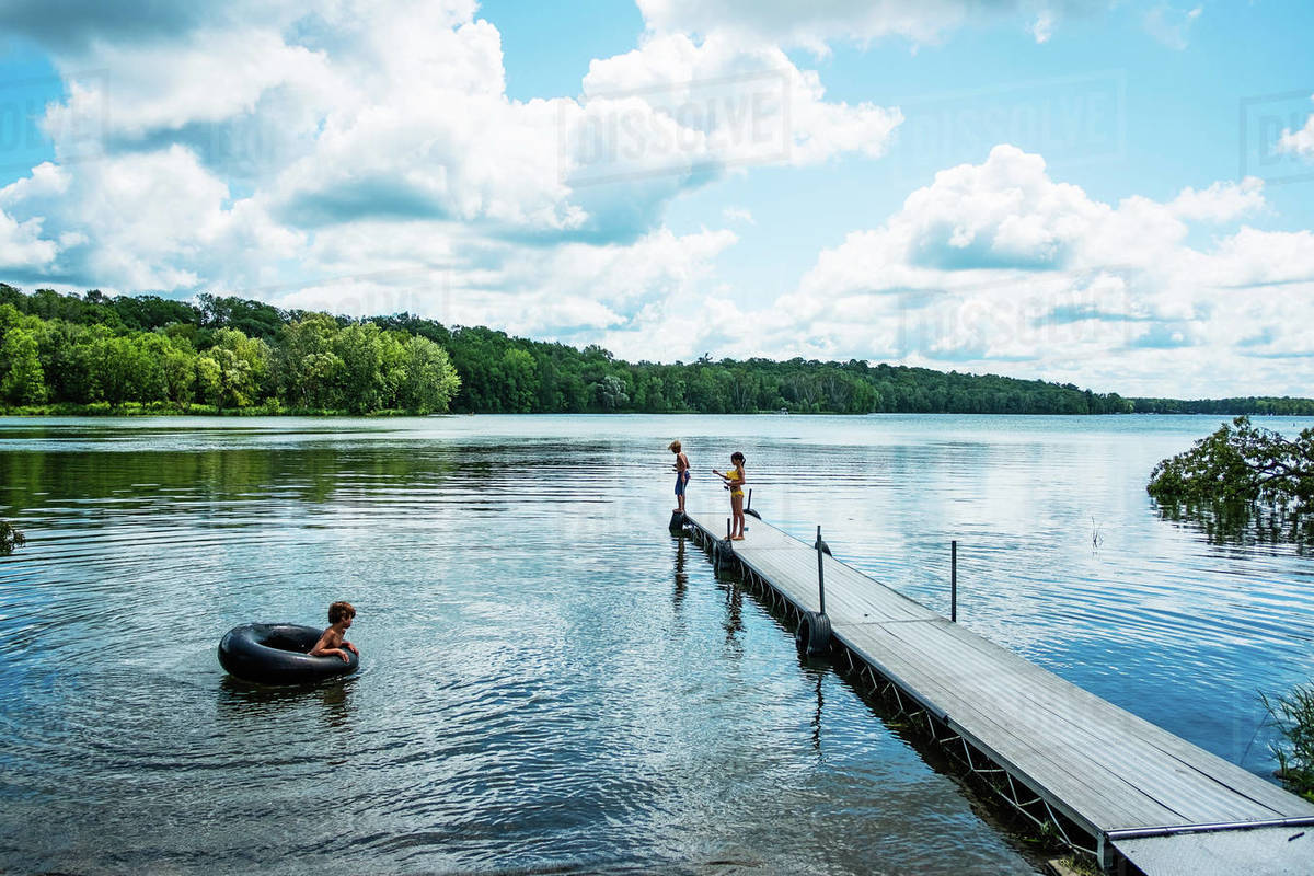 Three children at the lake fishing and having fun, USA - Royalty-free ...