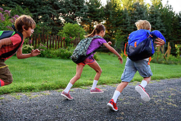 Three children running along a footpath, USA - Royalty-free Stock Photo ...