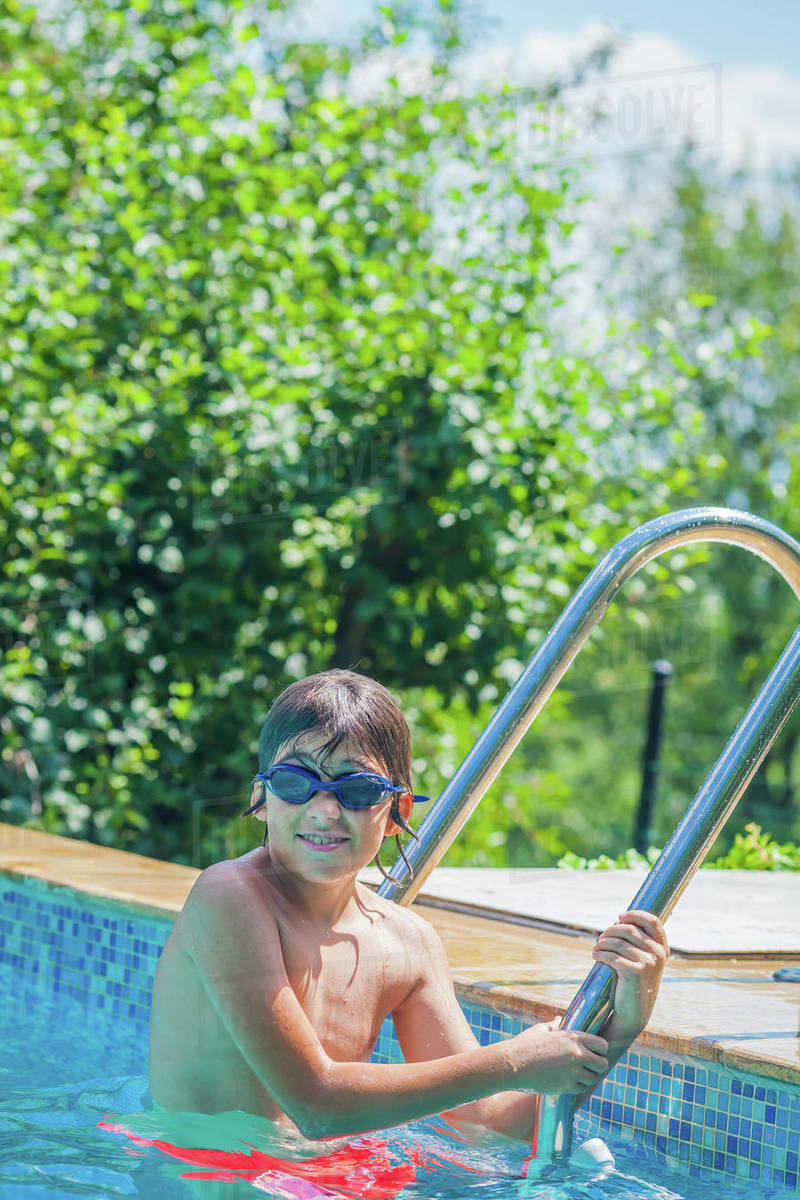 Smiling boy getting out of a swimming pool, Bulgaria - Royalty-free ...