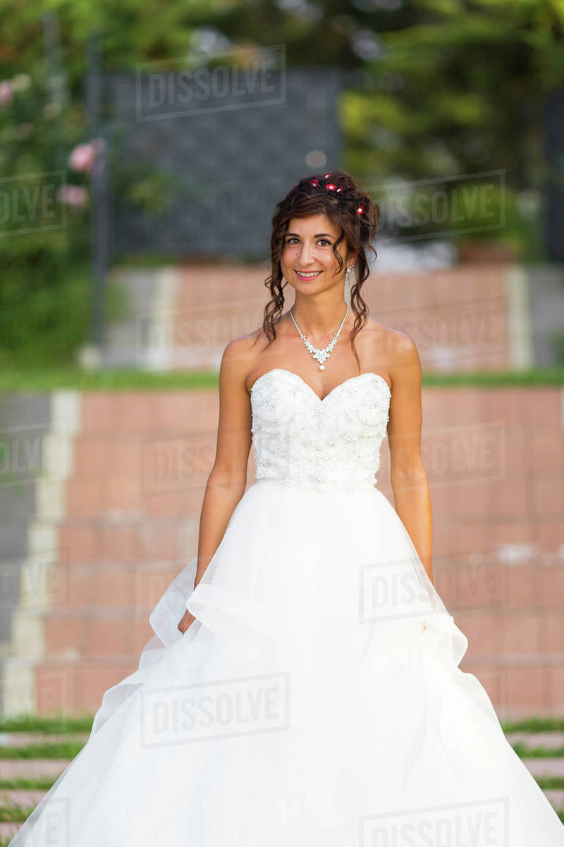 Portrait of a smiling bride - Stock Photo - Dissolve
