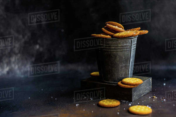 Salted cracker cookies in a metal bucket on a table - Royalty-free ...
