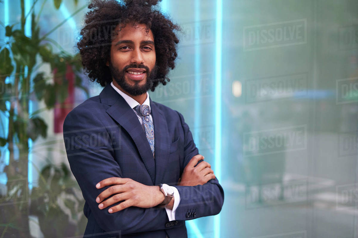 Confident and presentable African American businessman standing with ...