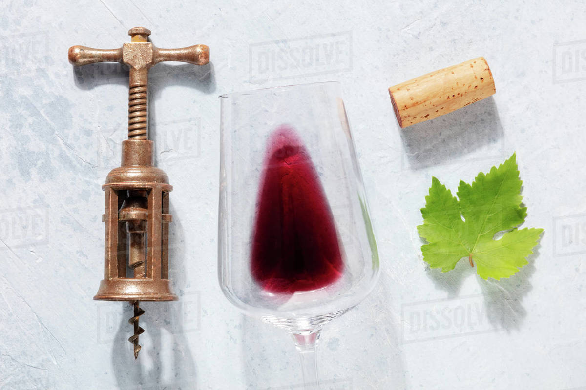 Top view of Red wine flat lay composition with a wineglass, a vintage ...