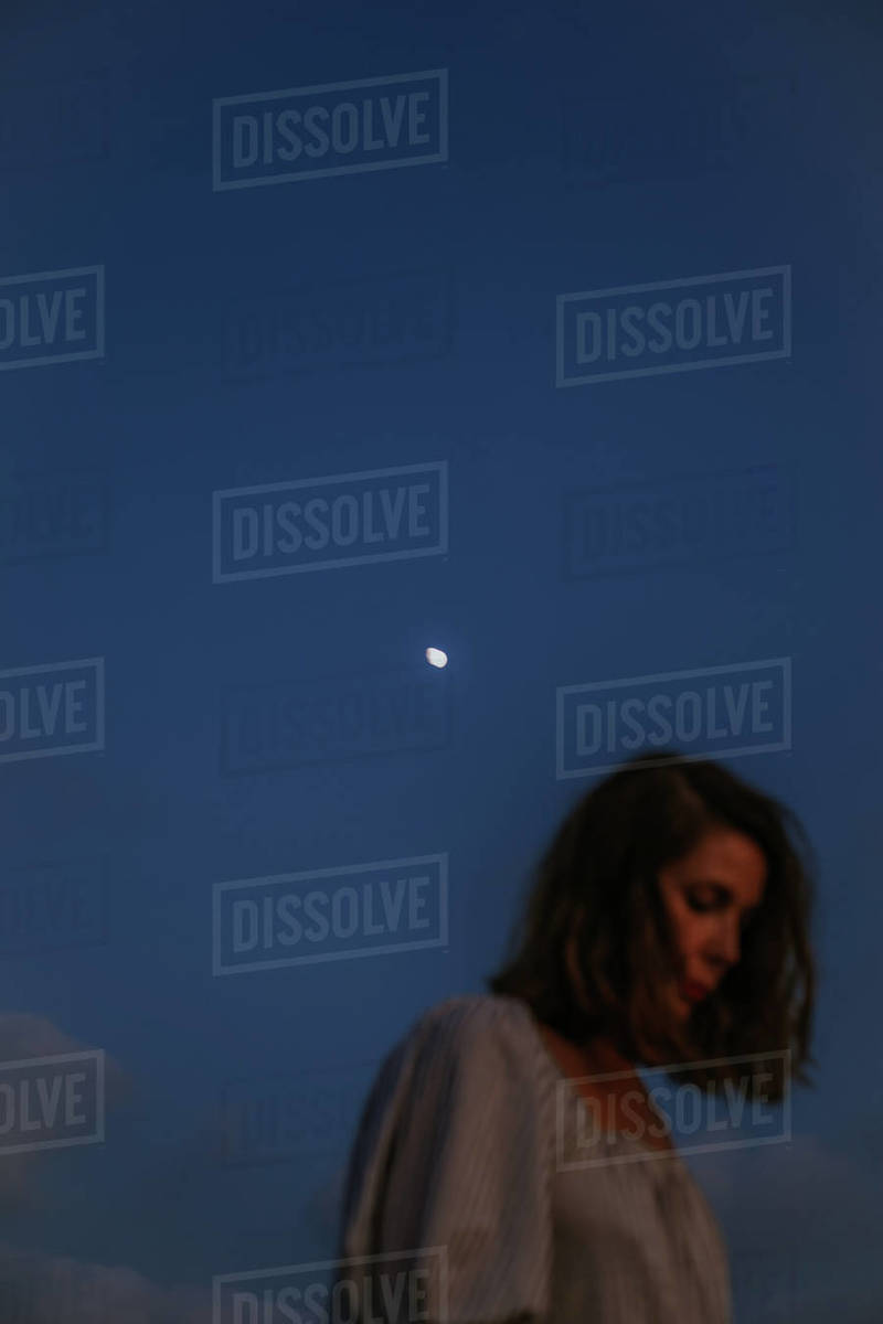 From below side view of blurred thoughtful woman relaxing on amazing ...