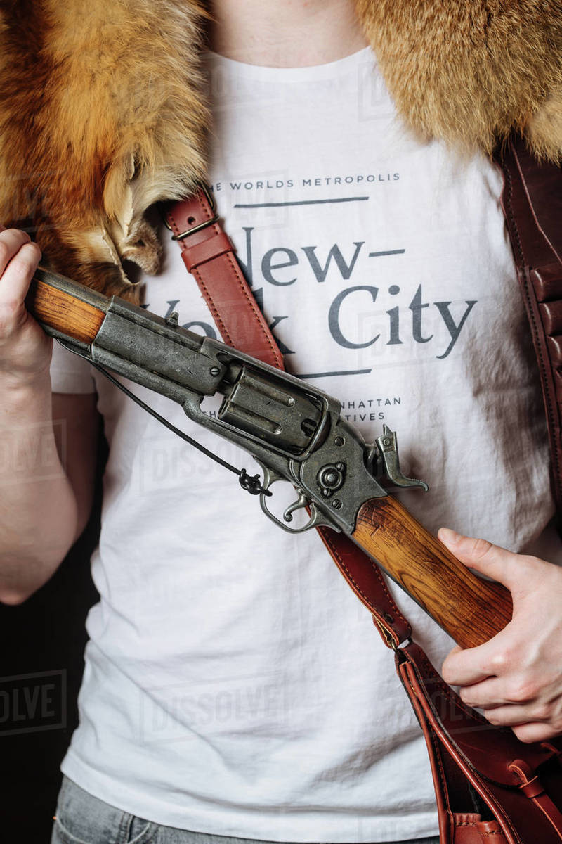 Crop man in stylish white t shirt with fox fur pelt on neck and leather ...