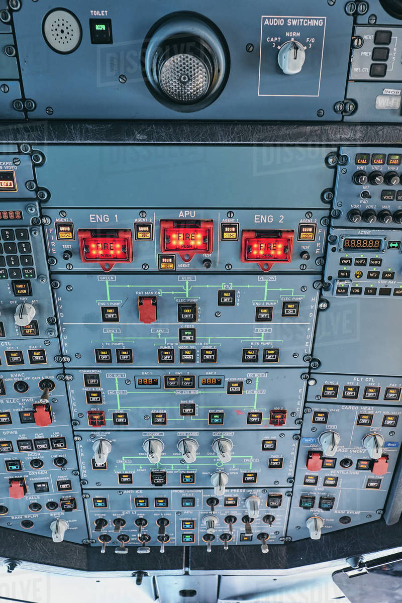 Fire buttons on control panel in cockpit - Stock Photo - Dissolve