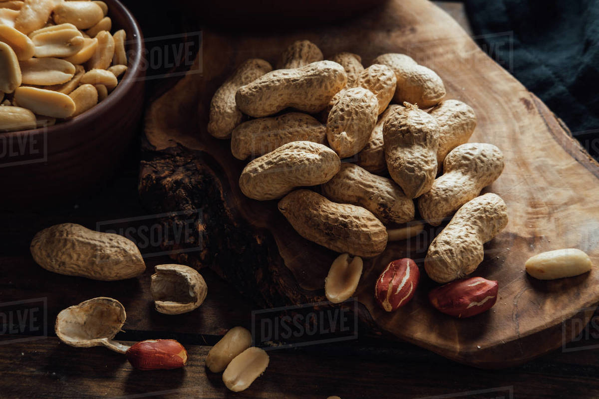 Group of peanuts on wooden boards - Royalty-free Stock Photo | Dissolve