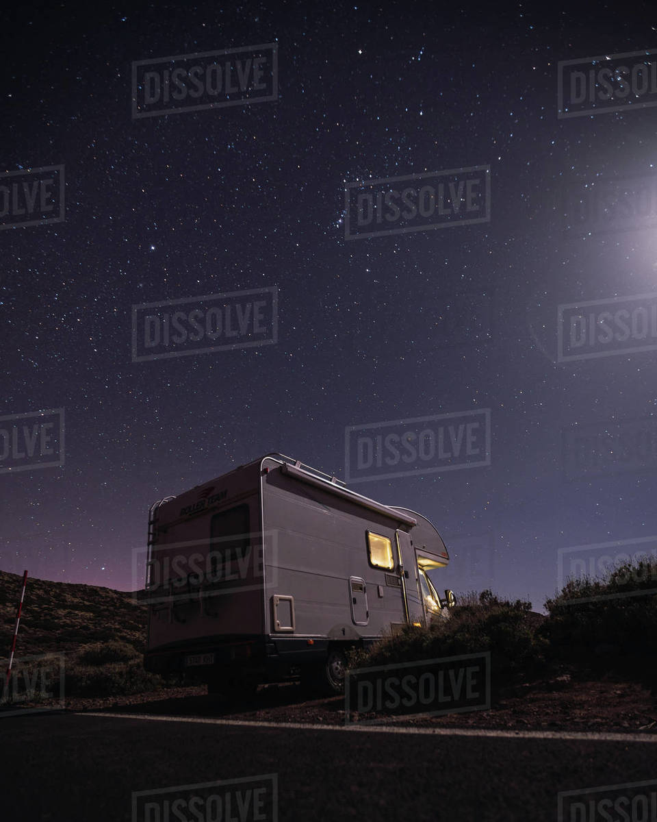 Caravan on roadside under night starry sky - Royalty-free Stock Photo ...