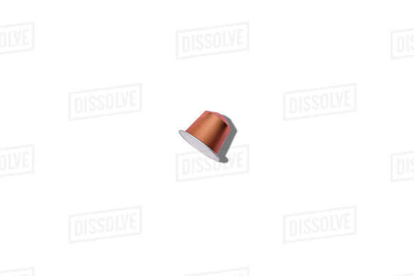 Top view of brown coffee pod placed on white background - Stock Photo ...