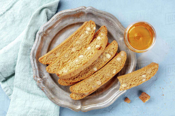 Biscotti, traditional Italian almond biscuits, with a glass of vin ...
