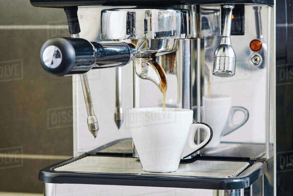 Professional coffee machine made of stainless steel with shiny surface ...
