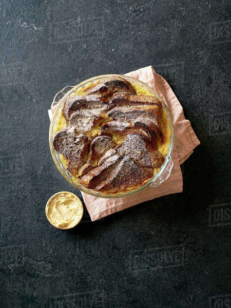 Top view of traditional bread pudding with custard, served with ...