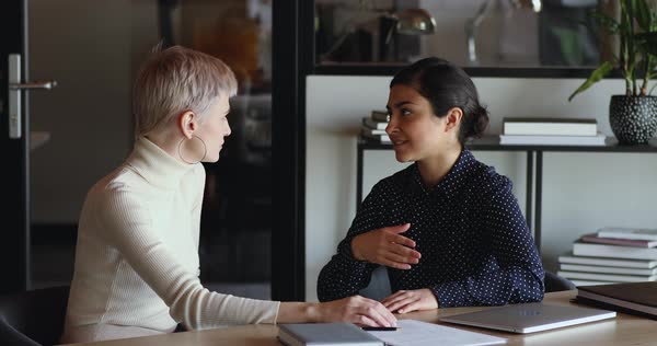 Professional indian saleswoman having business conversation negotiating ...