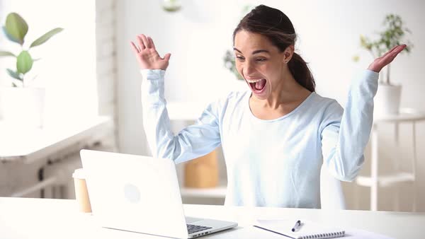 Happy young woman winner feeling overjoyed with online bid win - HD ...