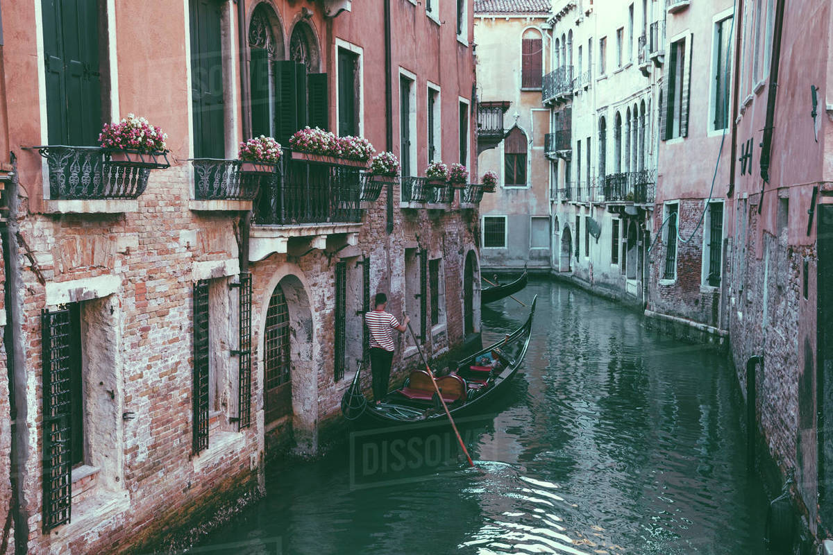 Panoramic view of Venice canal with historical buildings and gondolas ...