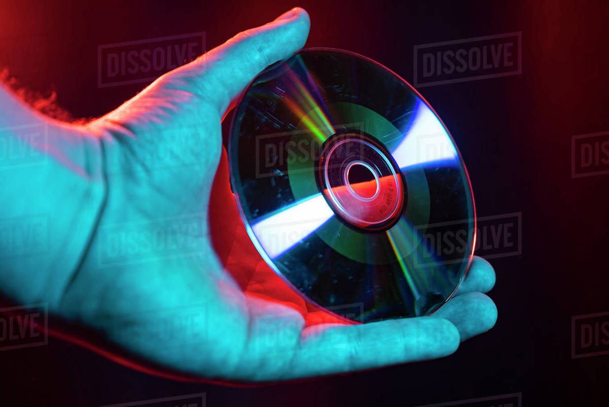 Cd hold in hand detail - Royalty-free Stock Photo | Dissolve