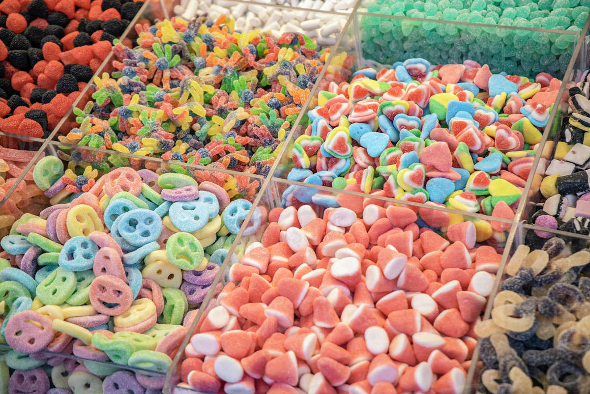 Assortment of gummy candies and sweets in the stall. Assorted colorful ...