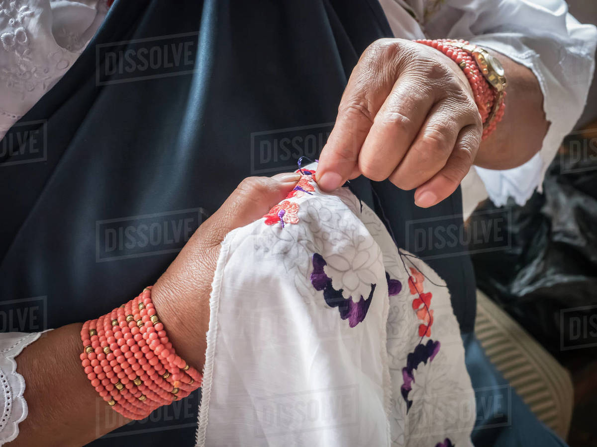 Indigenous woman doing traditional embroidery, Otavalo, Ecuador, South ...