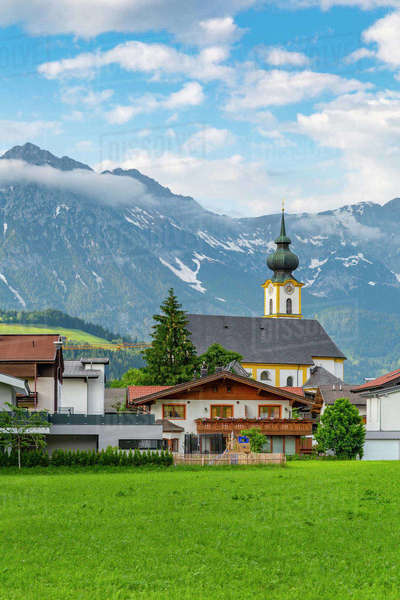 View of Pfarramt Soll Church and mountains in background, Soll ...