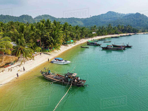 Aerial by drone of a Moken, sea gypsy village on a white sand beach ...