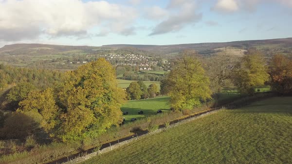 Aerial shot over fields towards Hathersage in autumn, Hathersage, Peak ...