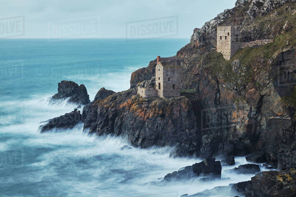 A dusk view of the iconic cliffside ruins of Botallack tin mine, UNESCO ...