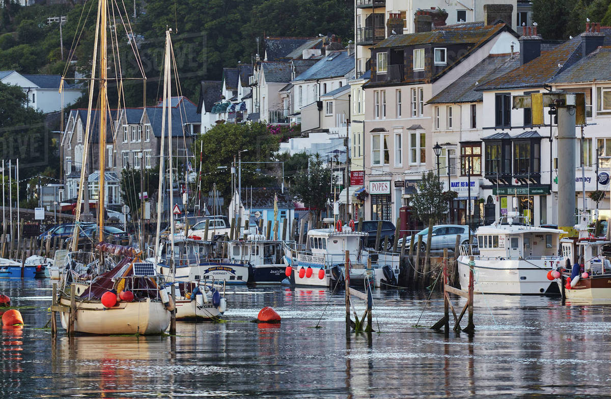 The well-known fishing harbour at Looe, in early morning sunlight, on ...