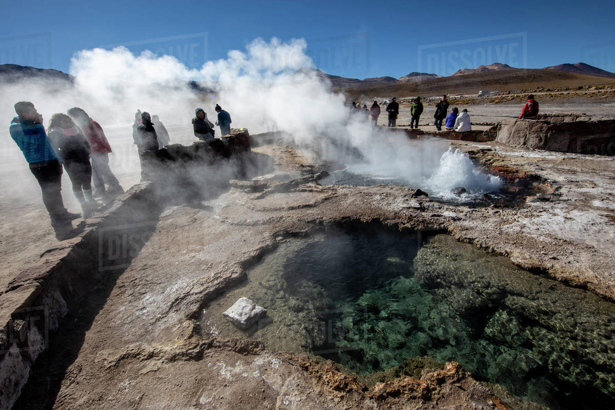 Tourists at the Geysers del Tatio (El Tatio), the third largest geyser ...