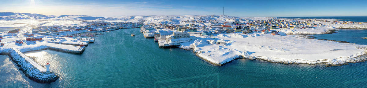 Aerial panoramic of Berlevag village covered with snow and cold Arctic ...