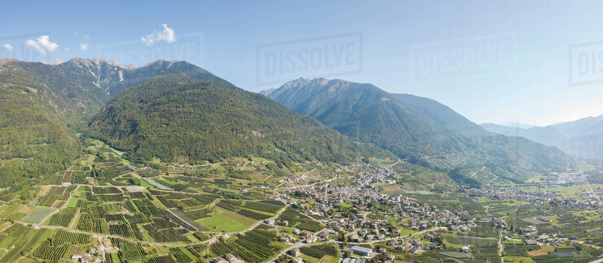 Aerial panoramic of apple orchards in between rural villages and ...