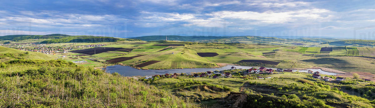 Panorama of Chinteni village and lake in summer, Romania, Europe ...