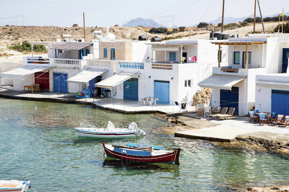Traditional fishermen's houses by the sea in Milos, Cyclades, Aegean ...