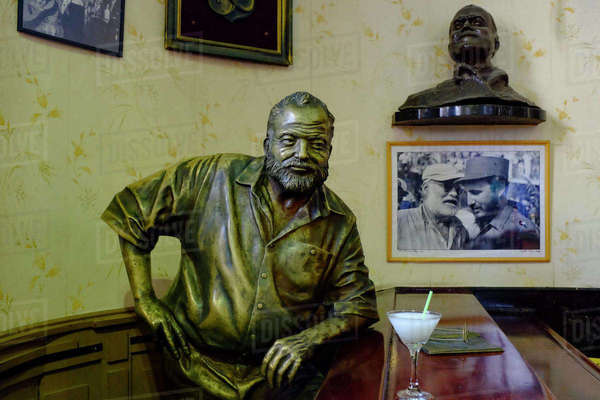 Life-size sculpture of Ernest Hemingway sitting at the bar of the ...