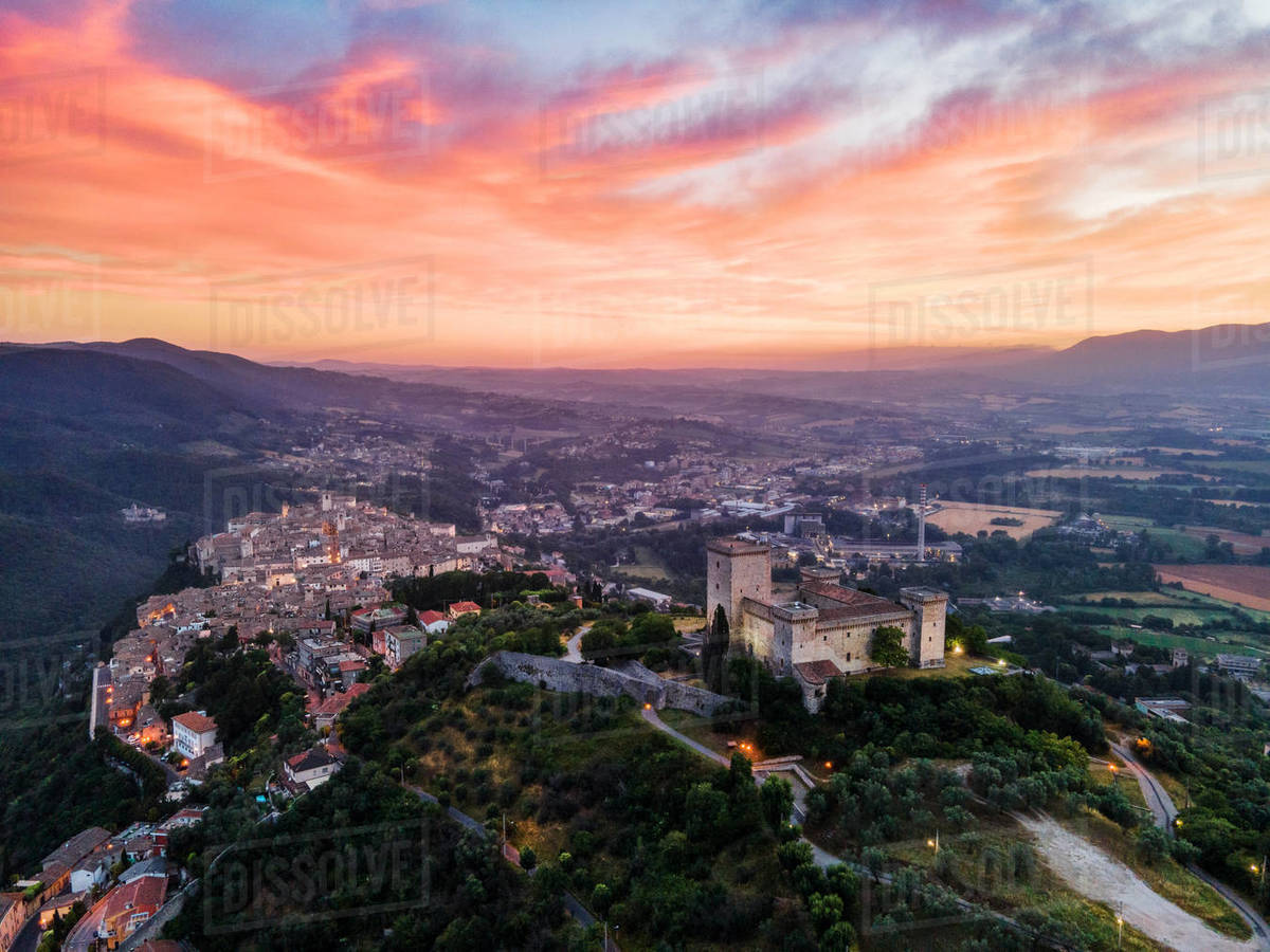 Cityscape of Narni at sunrise, with the fortress at the front and the ...