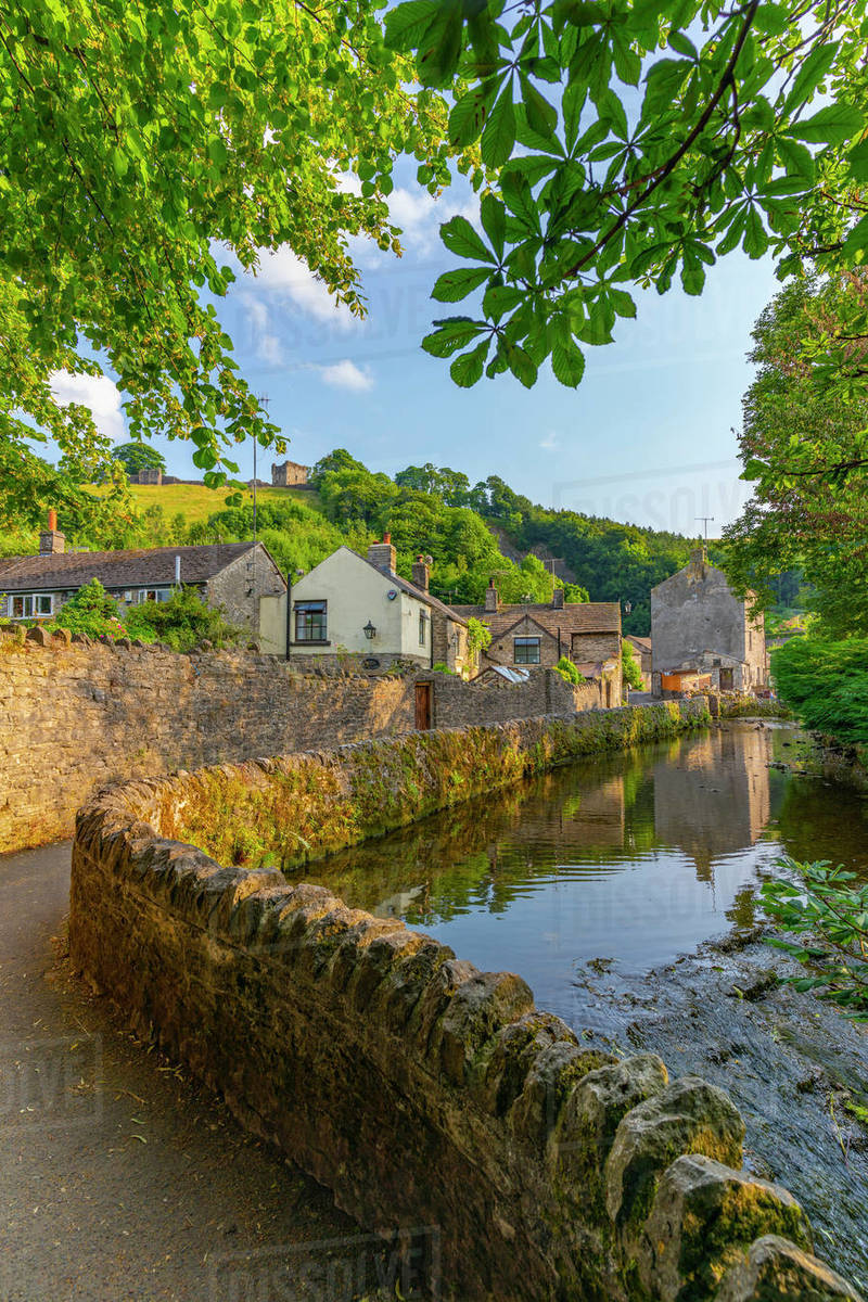 View of Castleton village and stream overlooked by Peveril Castle, Hope ...
