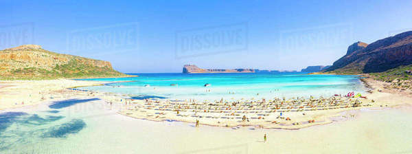 People sunbathing on idyllic white sand beach, Balos, Crete, Greek ...