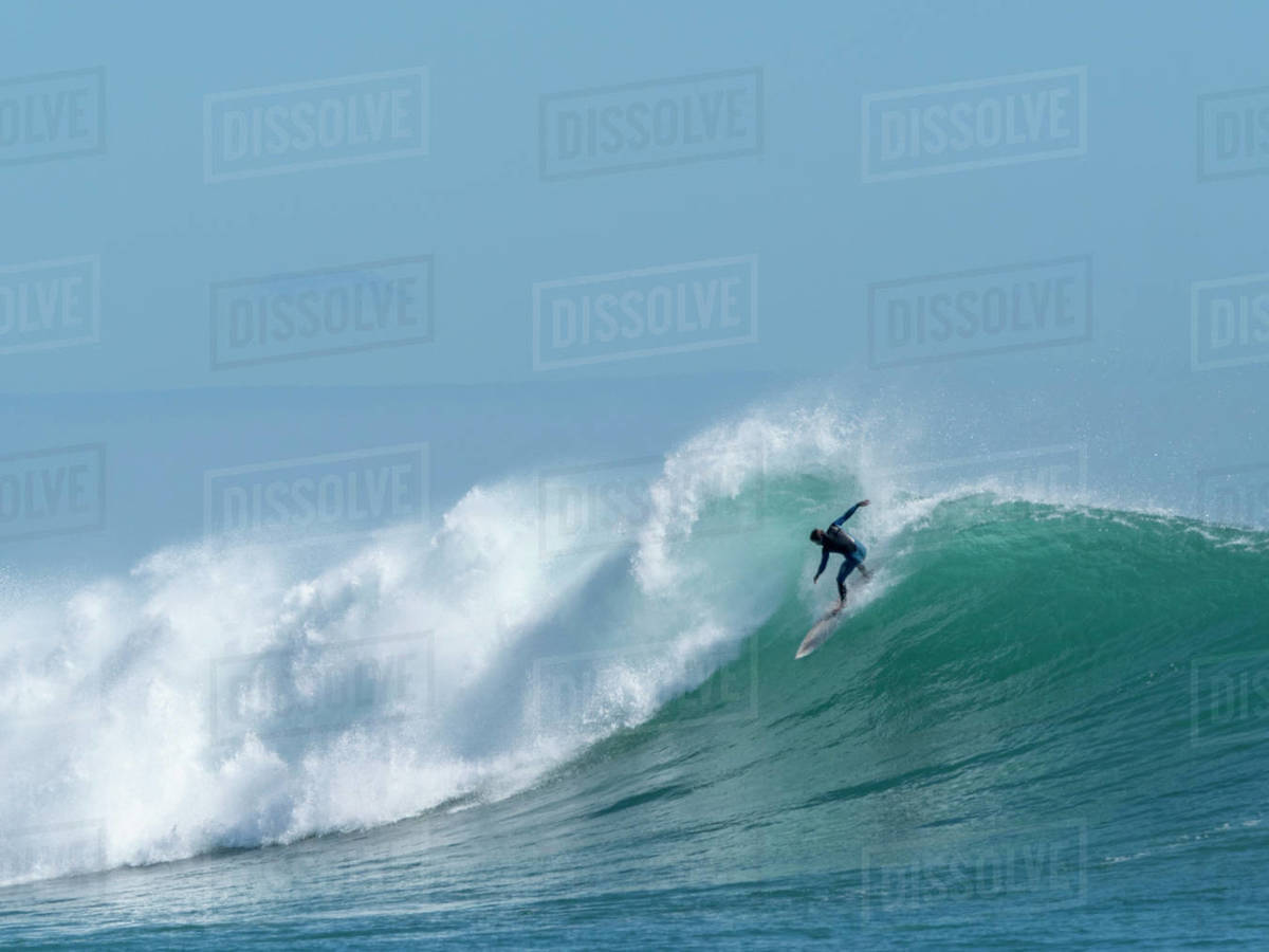 Surfer at North Reef, Lighthouse Bay, Exmouth, Western Australia ...
