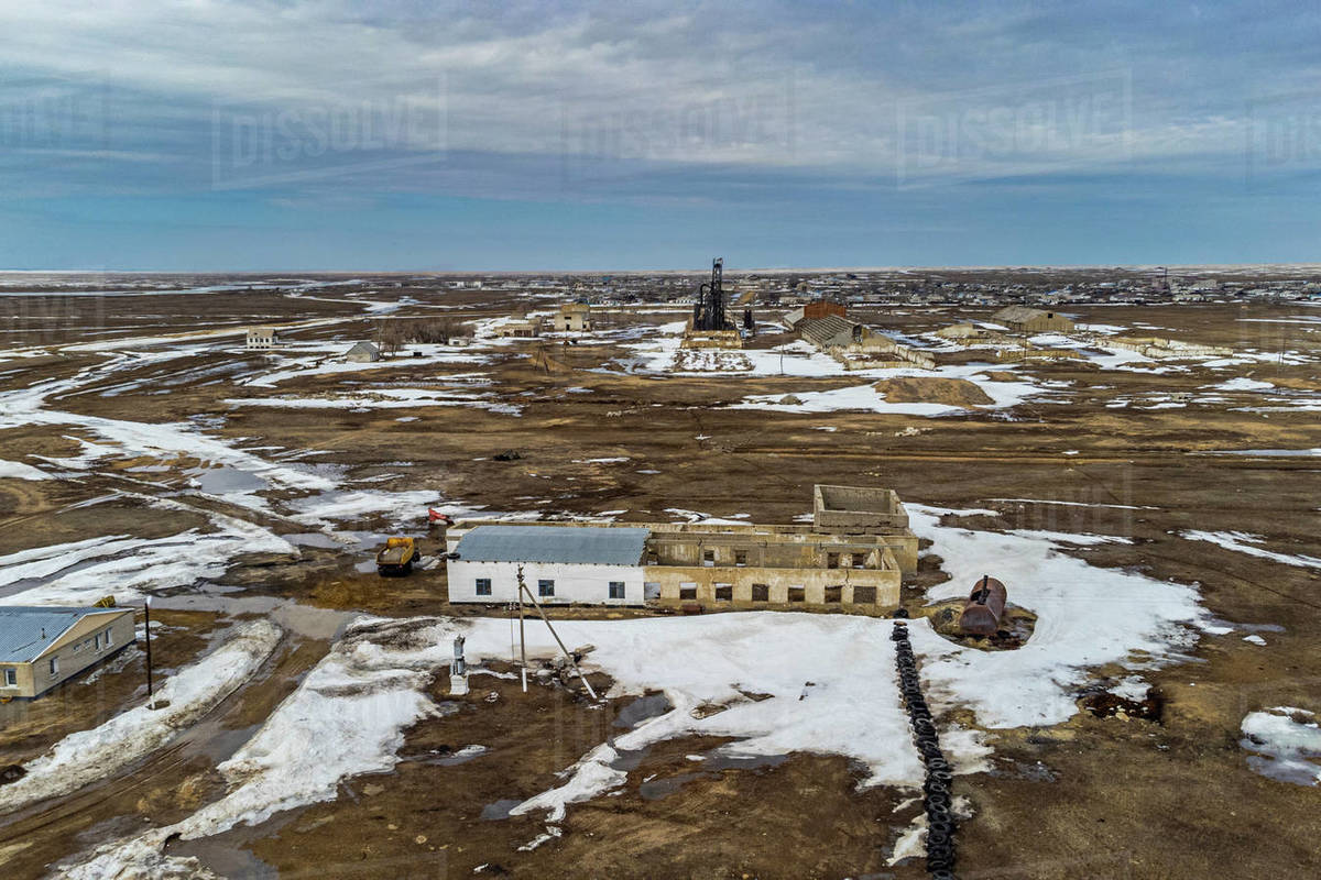 Aerial of an old wheat farm in the semi frozen earth, South of Kostanay ...