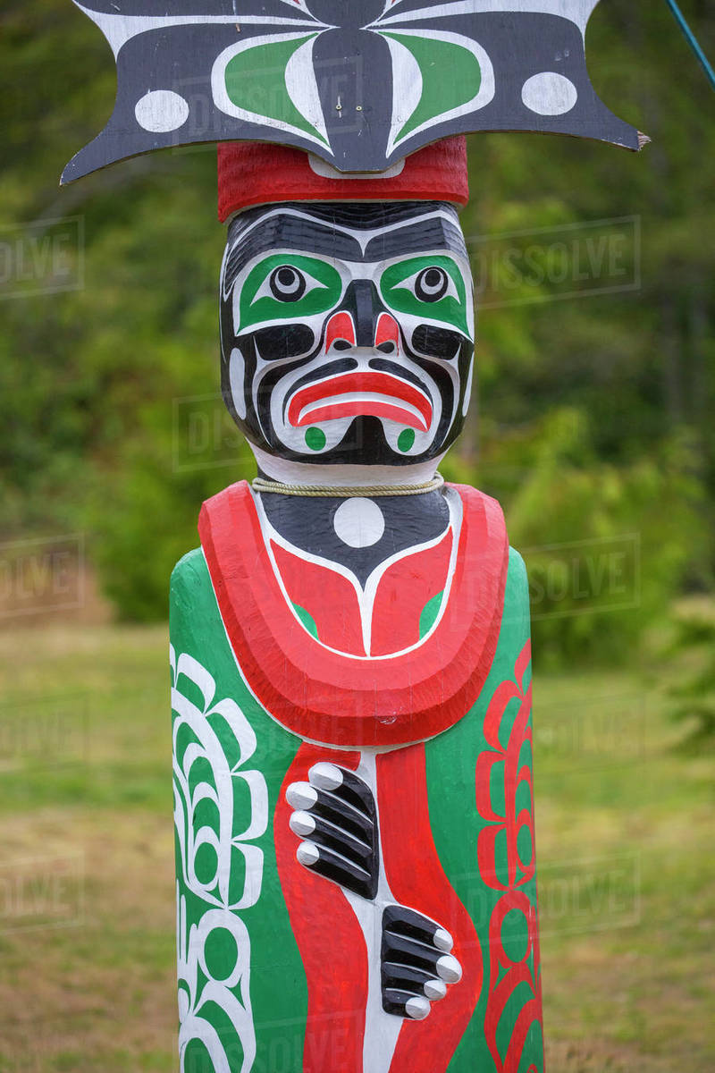 Kwakwaka'wakw totem poles in the cemetery in Alert Bay, Cormorant ...