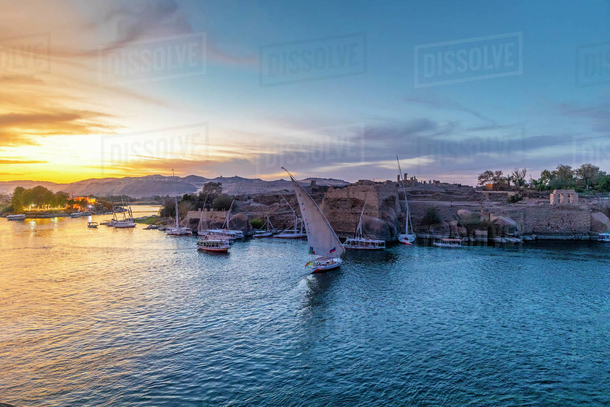 Feluccas on The River Nile at sunset, Aswan, Egypt, North Africa ...