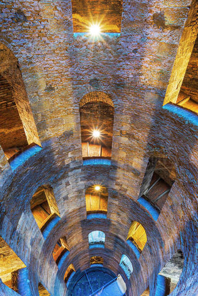 Illuminated view of the bottom of Saint Patrick's well with a spiral ...