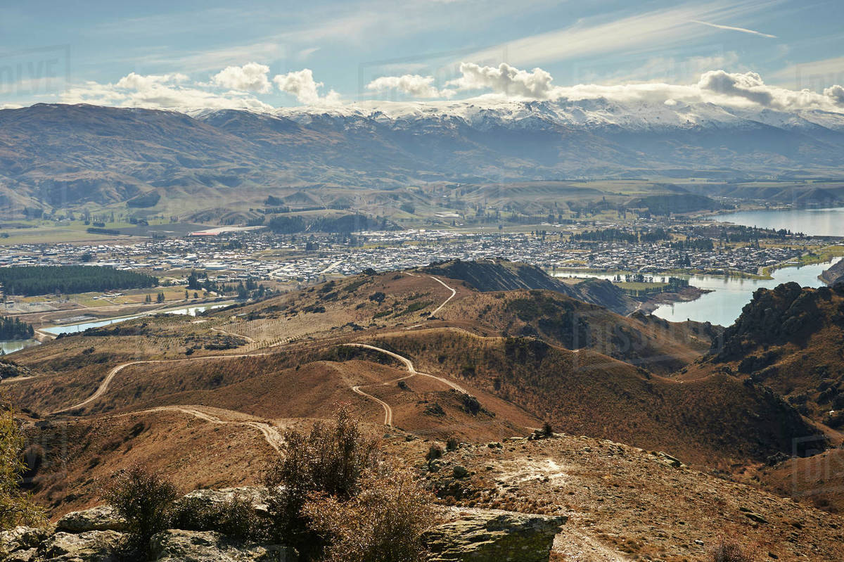 View to outskirts of Cromwell over man-made Lake Dunstan and gold ...