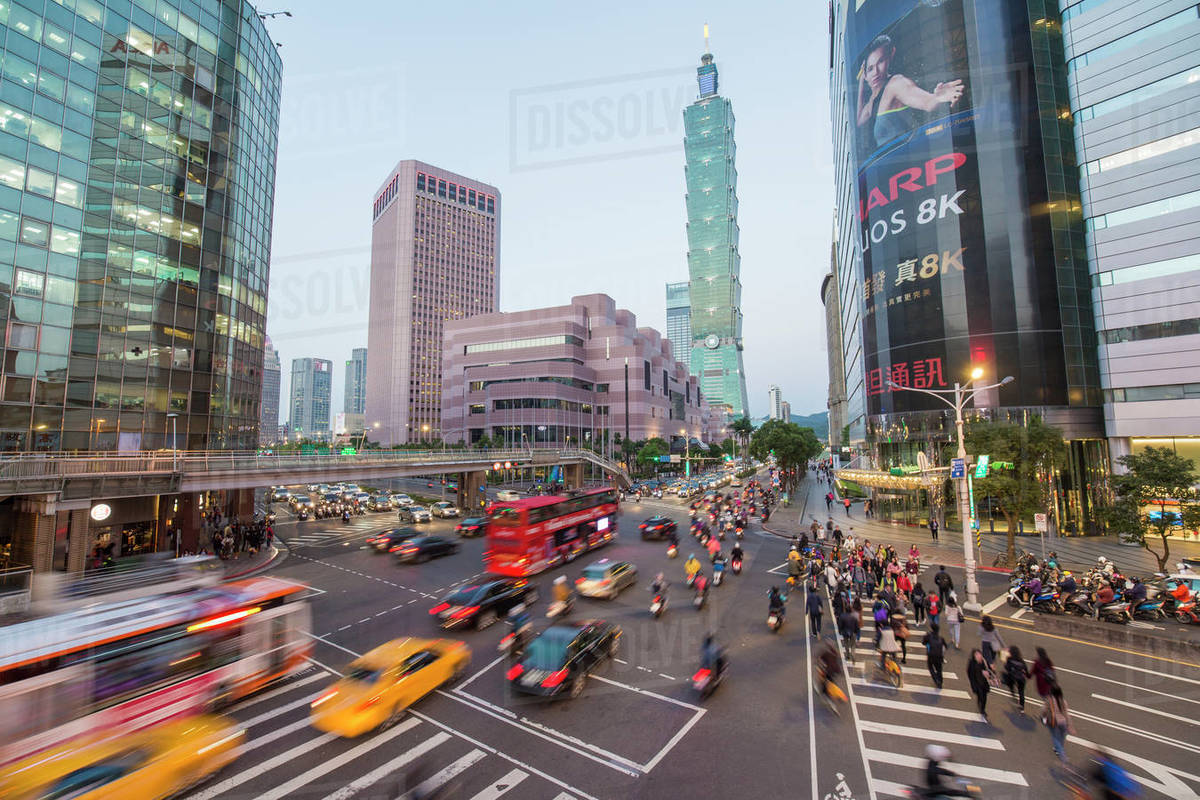 Traffic in front of Taipei 101 at a busy downtown intersection in the ...