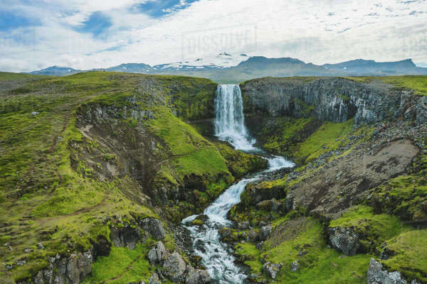 Aerial view of Svodufoss Waterfall and mount Snaefell. Landscape on ...